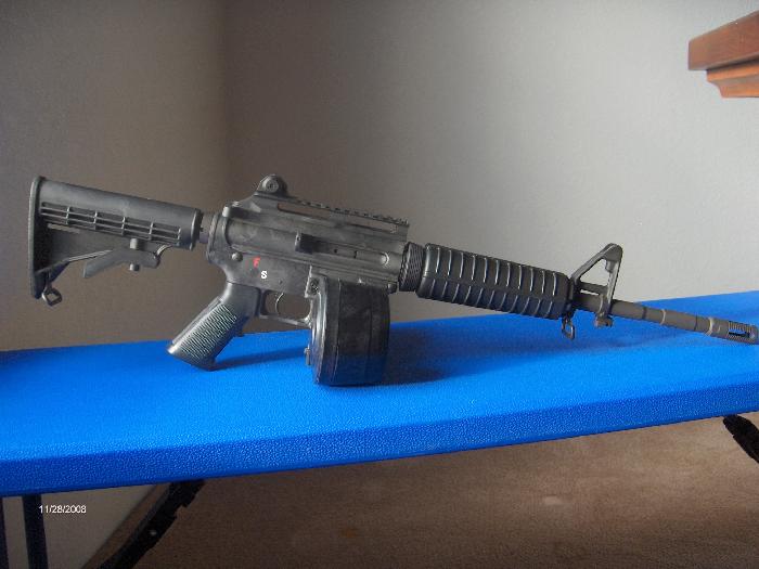 Bushmaster Firearms Inc. - Carbon-15 M4 Carbine w/100 Rnd Drum Mag 5.56 ...