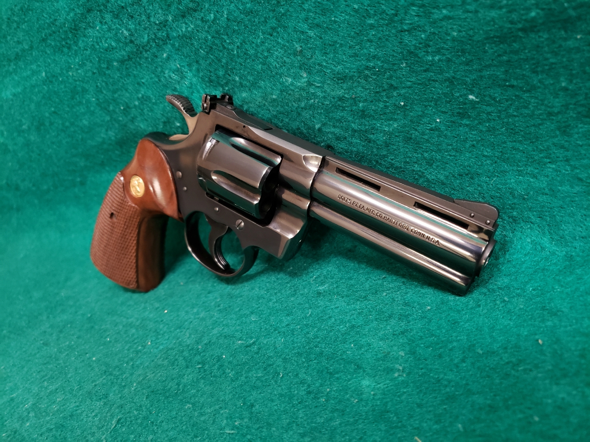 Colt - PYTHON - BLUED. 4 INCH BARREL. ORIGINAL GRIPS. W-OWNERS MANUAL ...